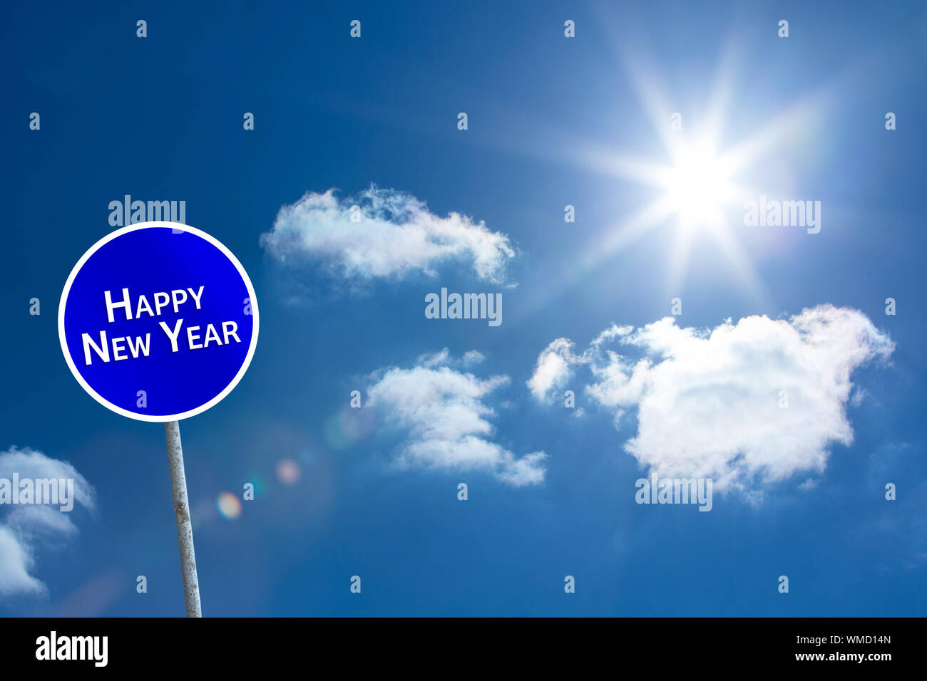 Happy new year against bright blue sky with clouds Stock Photo - Alamy