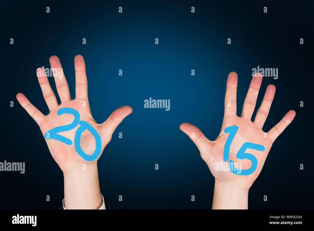 Hands against blue background with vignette Stock Photo - Alamy