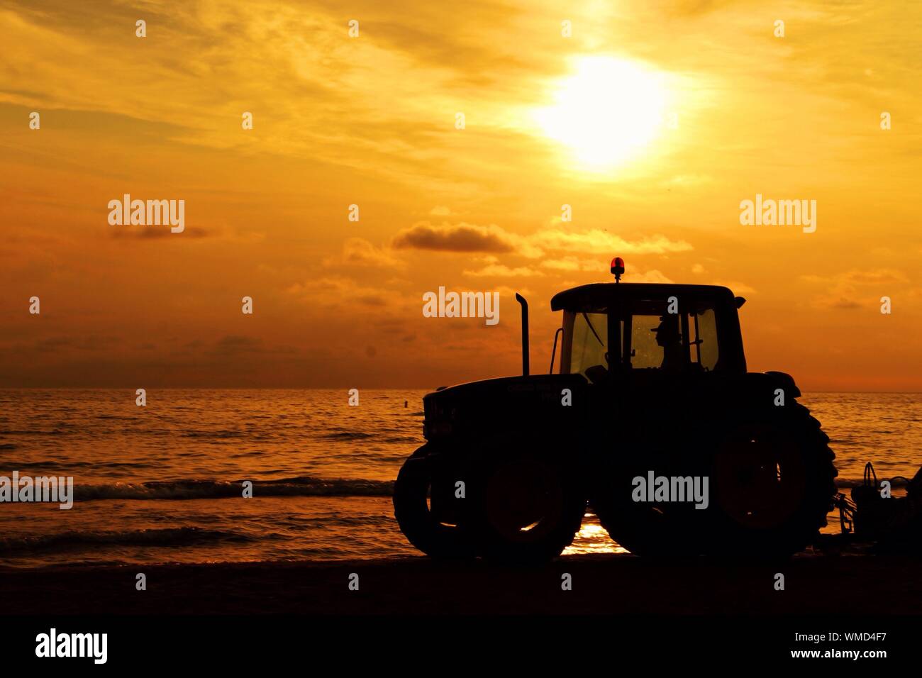 Tractor in sunset hi-res stock photography and images - Alamy