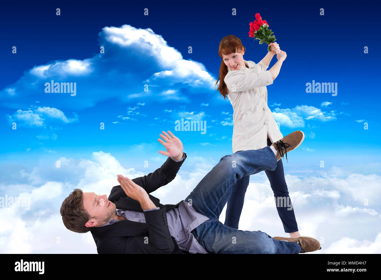 Woman throwing roses at man against bright blue sky with clouds Stock ...