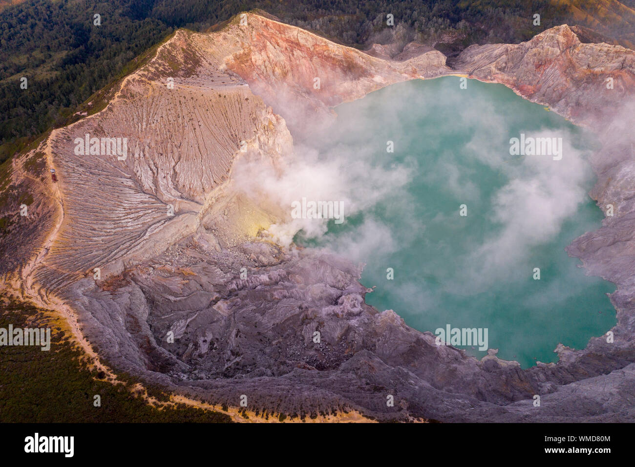 Kaweh Ijen volcano crater in Eastern Java, Indonesia billowing sulphur ...