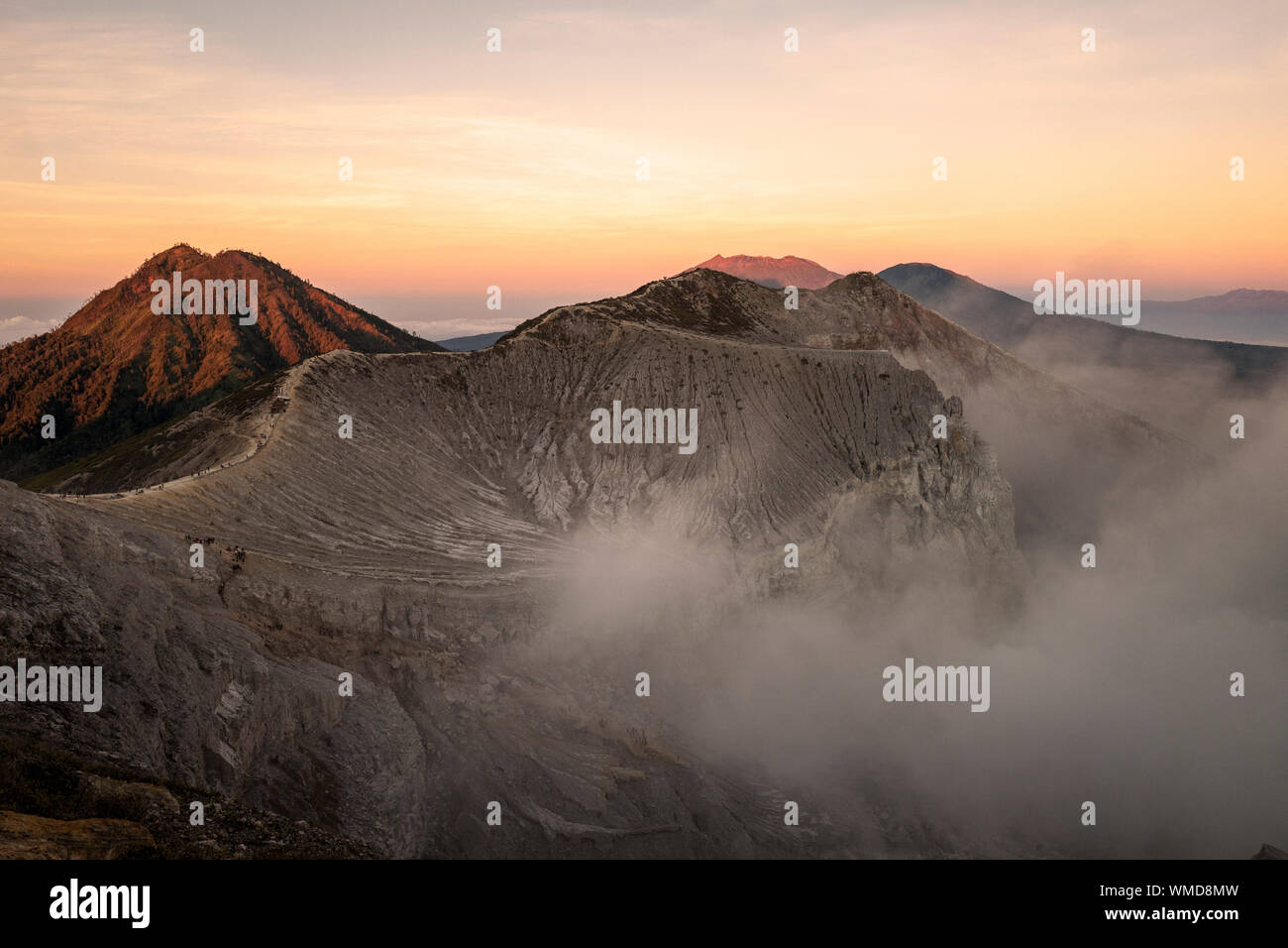 Kaweh Ijen volcano crater in Eastern Java, Indonesia billowing sulphur ...