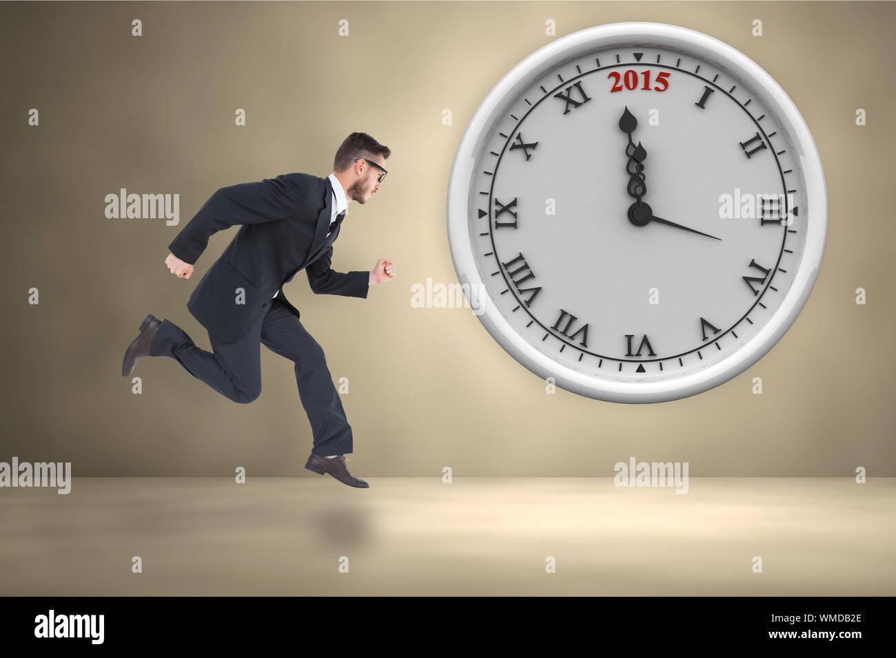 Geeky young businessman running mid air against grey room Stock Photo ...