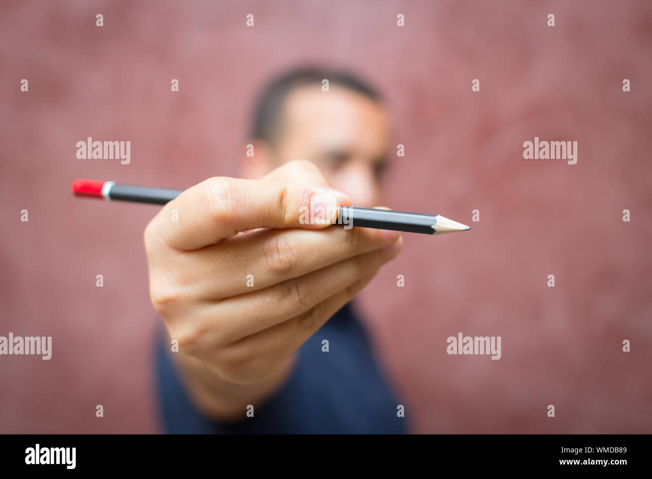Man with pencil hi-res stock photography and images - Alamy