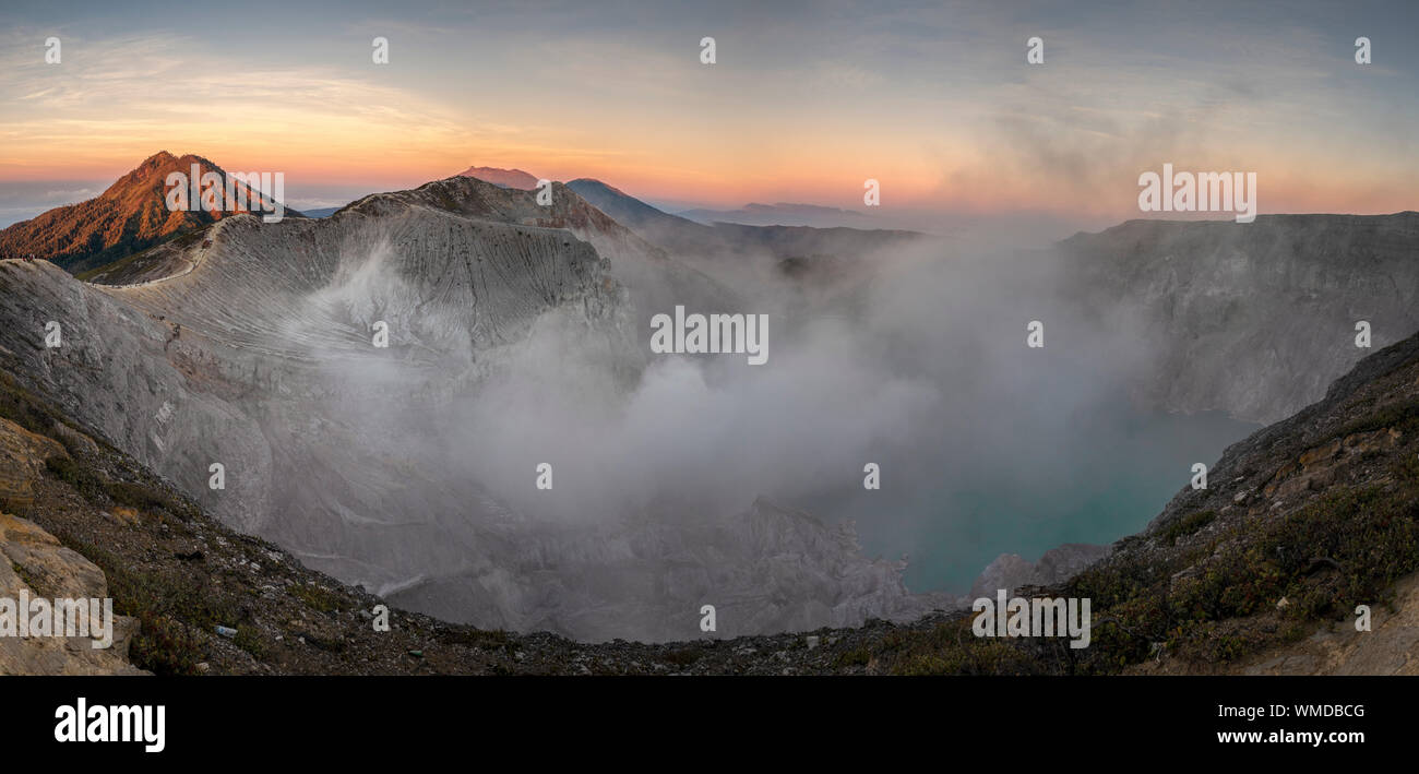Kaweh Ijen volcano crater in Eastern Java, Indonesia billowing sulphur ...
