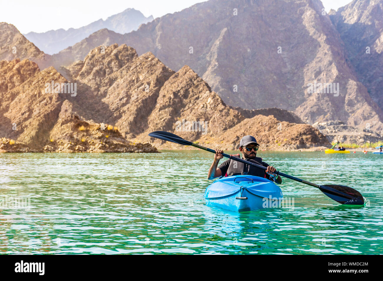 Hatta Kayaking young man kayaking in Hatta Dam beautiful place for ...