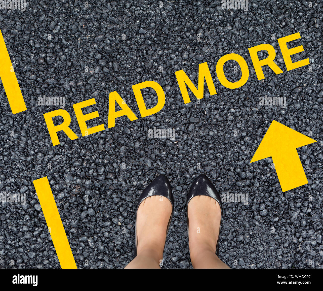 Businesswomans feet against black road Stock Photo - Alamy