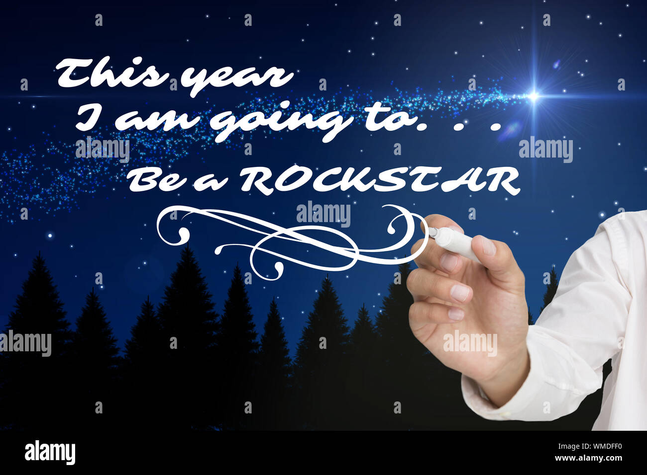 Businessman about to write something against shooting star over forest ...