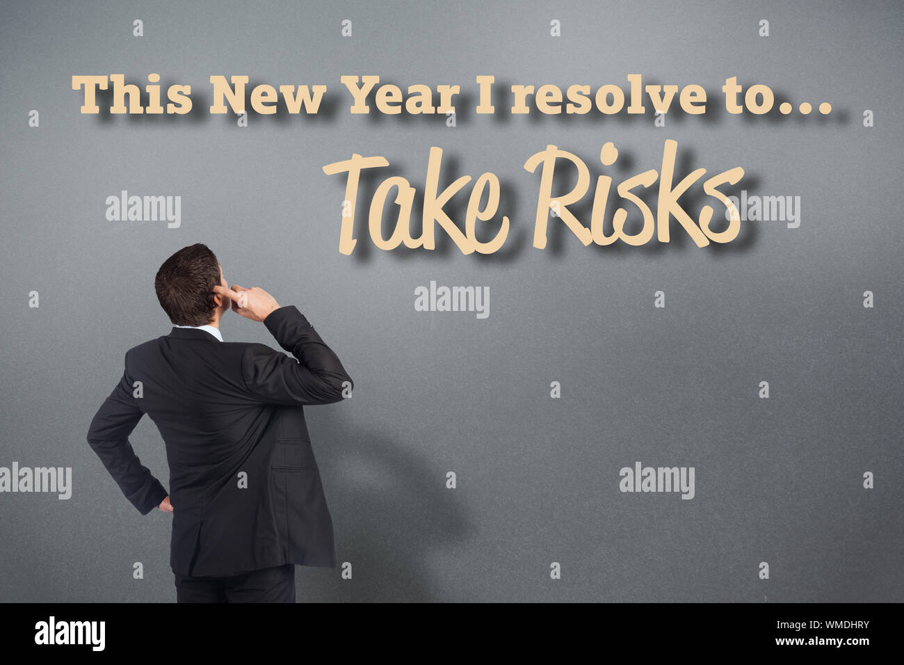 Thinking businessman scratching head against grey vignette Stock Photo ...