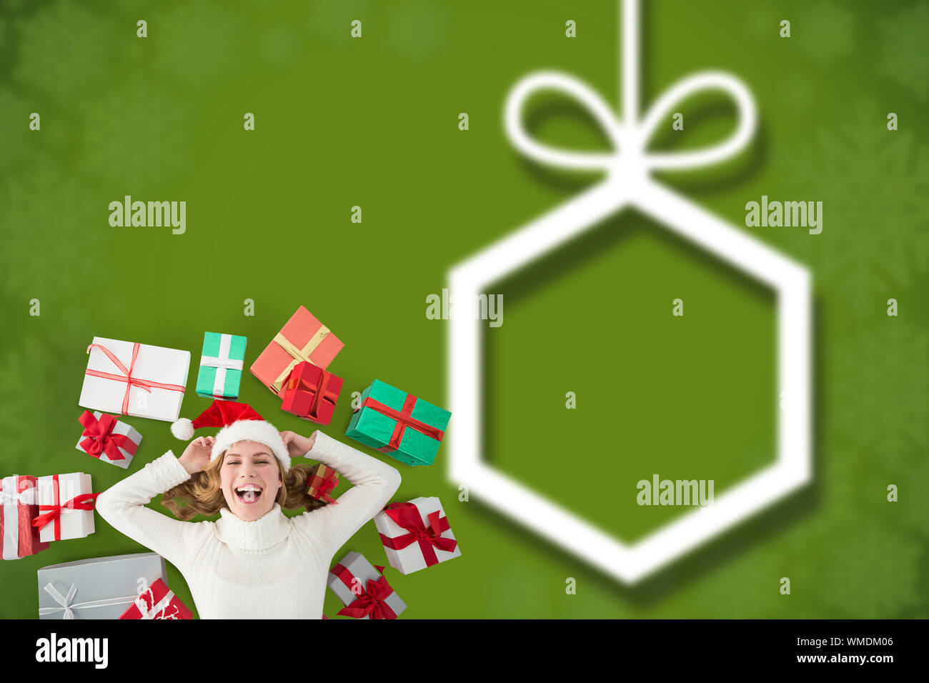 Woman laying on the floor with gifts around her against blurred ...