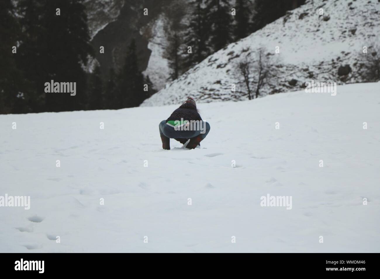 Rear view crouching woman High Resolution Stock Photography and Images ...