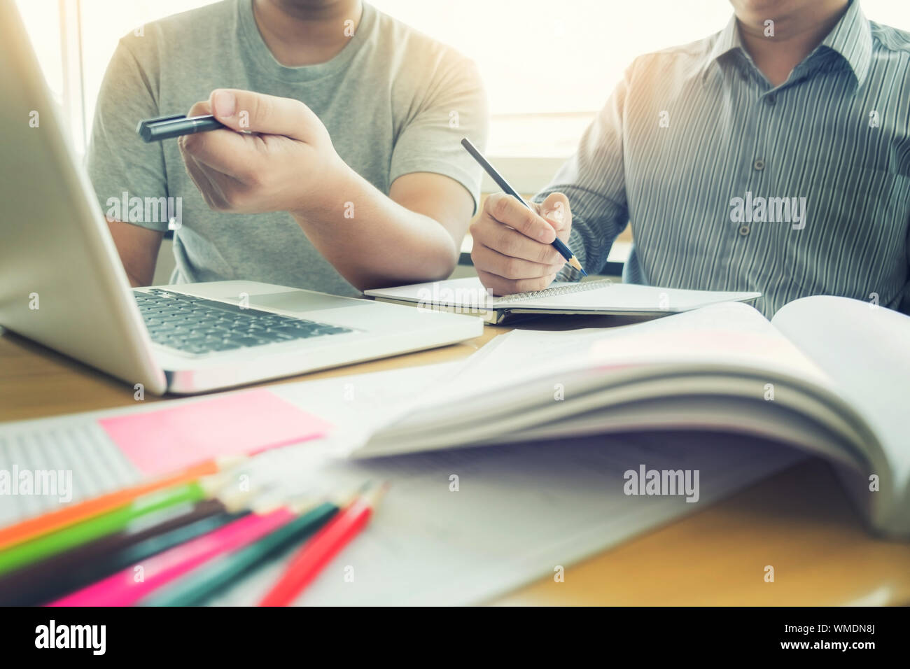 Students sitting table hi-res stock photography and images - Alamy