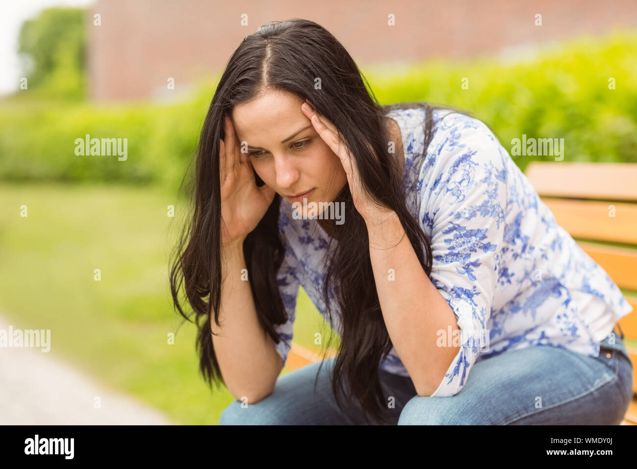 Hands on temples hi-res stock photography and images - Alamy