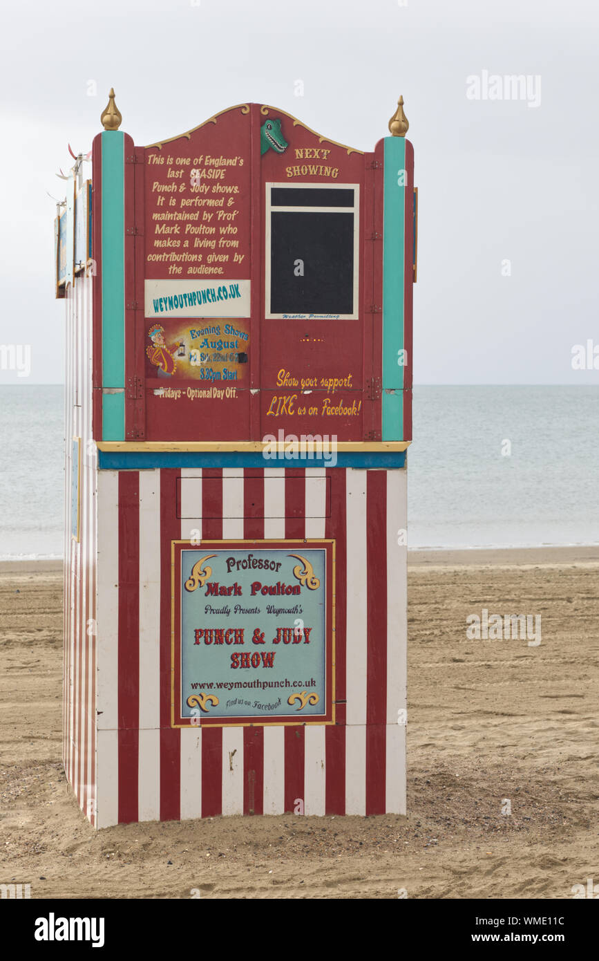 Punch and judy booth on an overcast beach in weymouth Stock Photo - Alamy