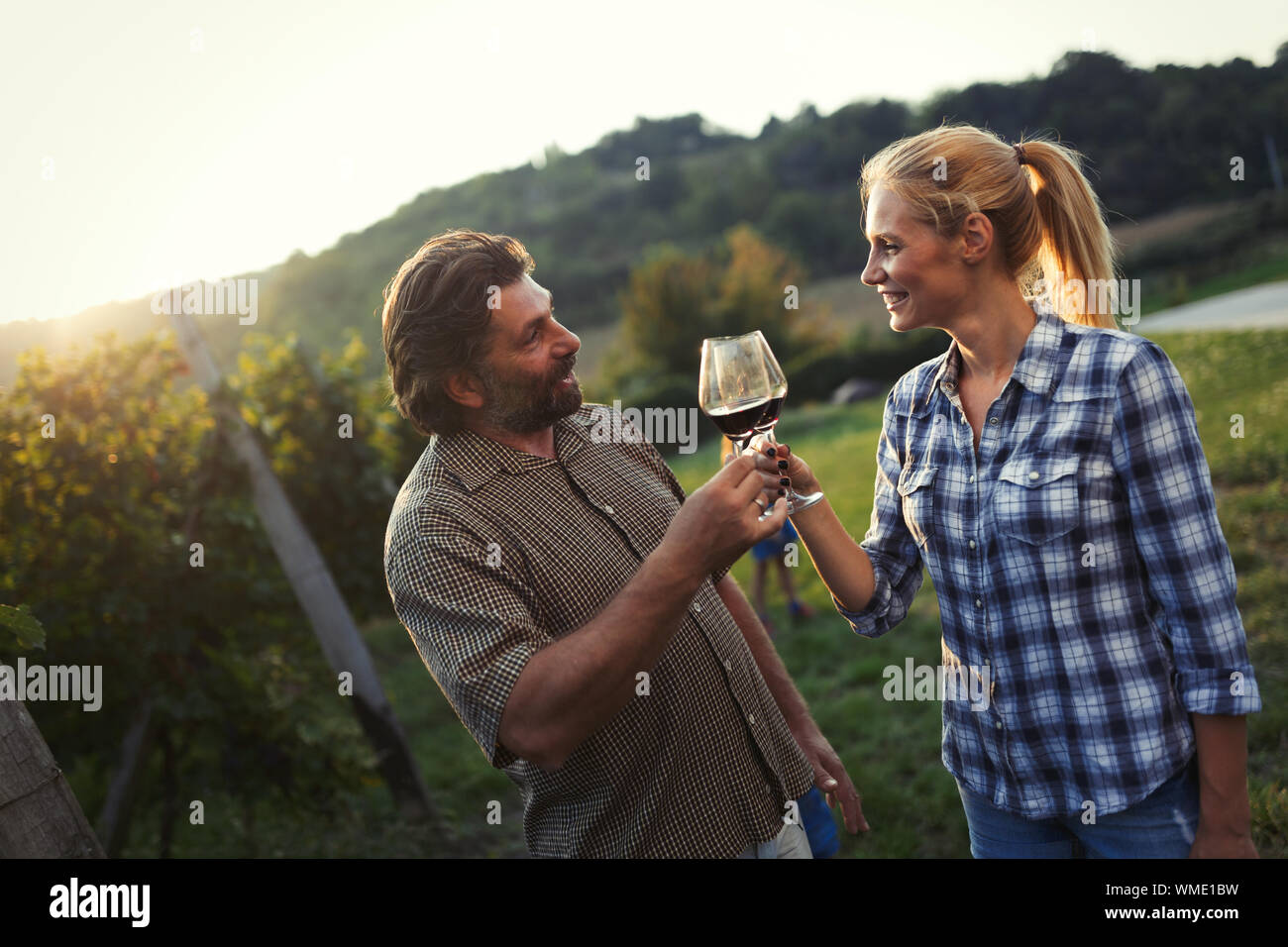 Picture of people tasting red wine in vineyard Stock Photo - Alamy