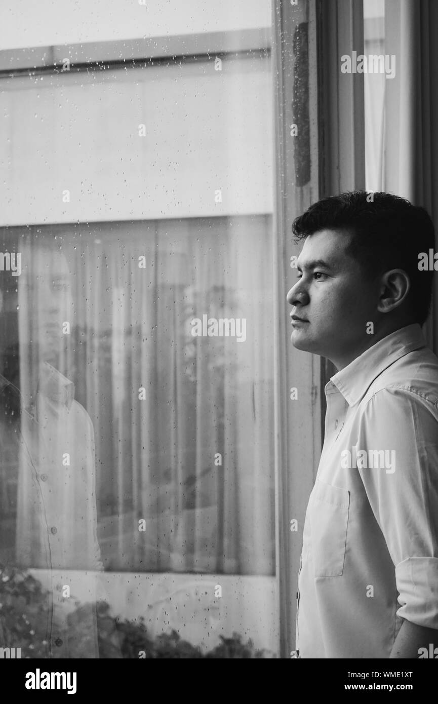Young man reflection window Black and White Stock Photos & Images - Alamy