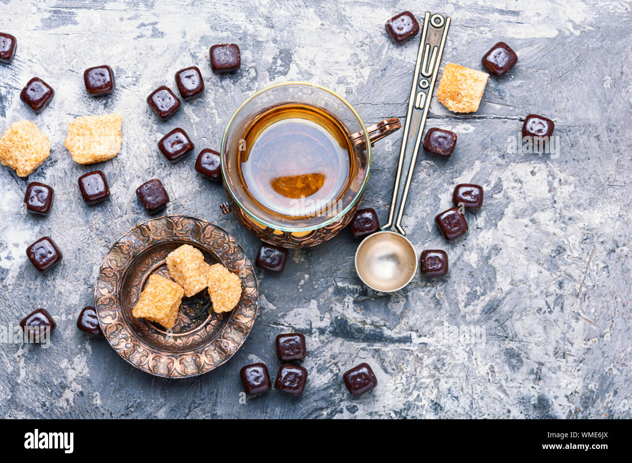 Eastern tea concept.Eastern tea in traditional glass with chocolate ...
