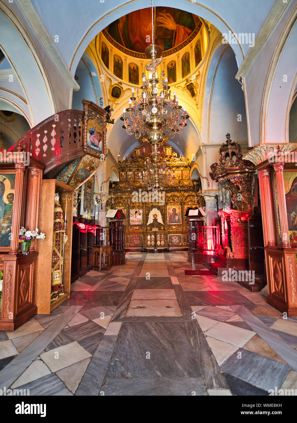 Interior with various sacred images and altars with decorations in ...