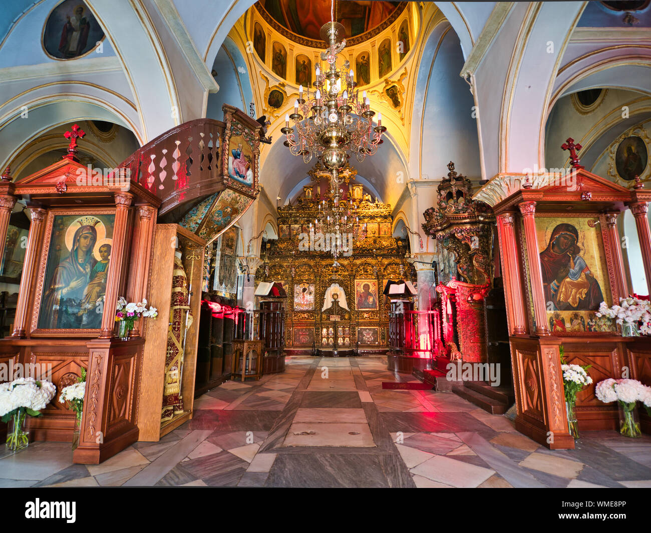Interior with various sacred images and altars with decorations in ...