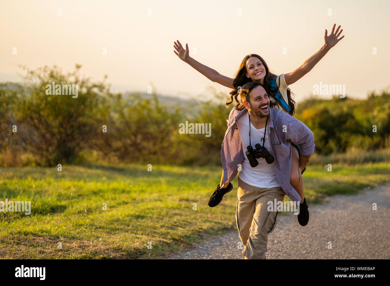 Happy couple is hiking in mountain. They are having fun in nature Stock ...