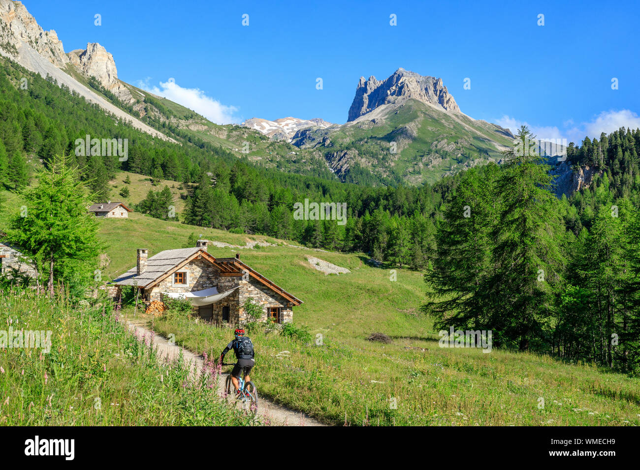 France, Hautes-Alpes, Nevache, Etroite Valley, mountain biker on hiking ...