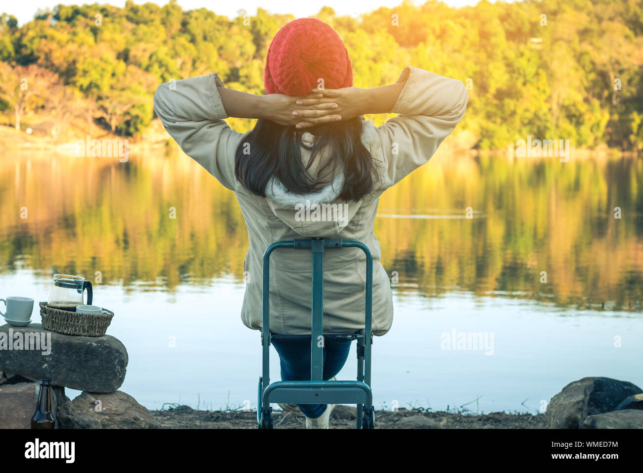 Young women sitting on riverbank hi-res stock photography and images ...