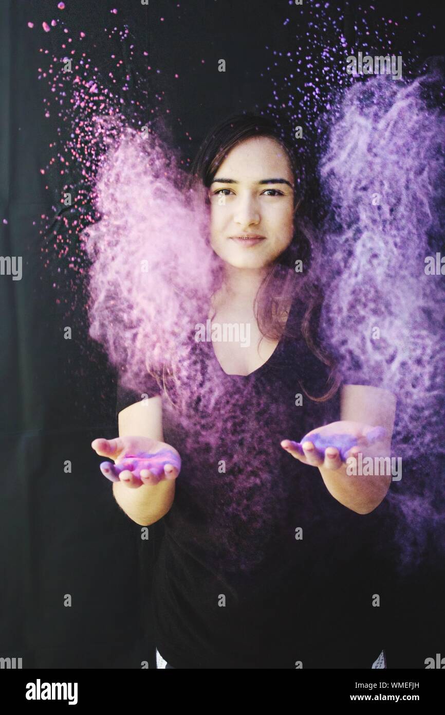 Throwing color powder hi-res stock photography and images - Alamy