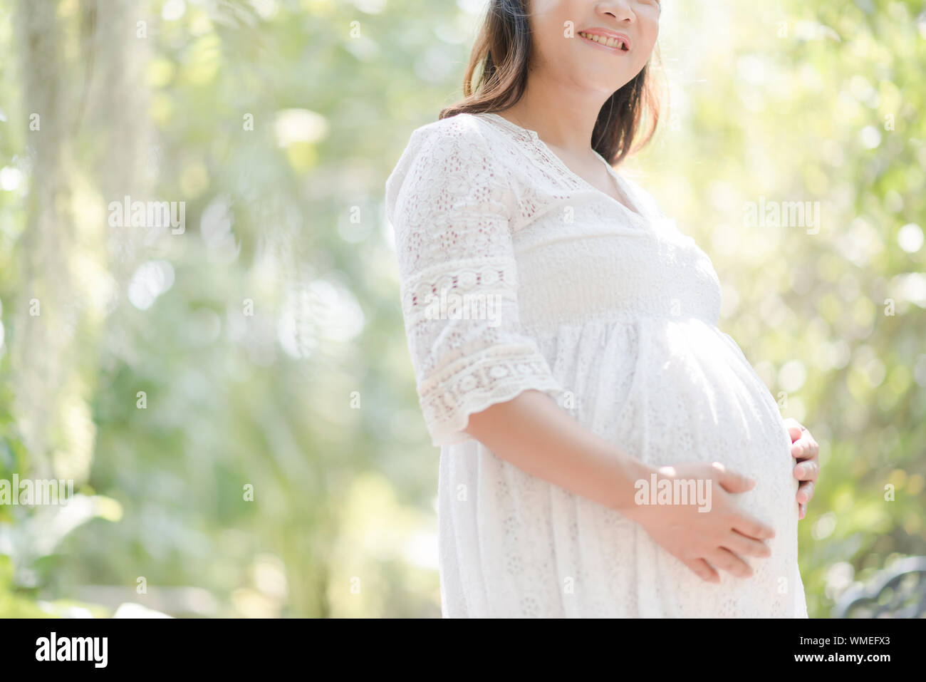 Pregnant mid adult woman hi-res stock photography and images - Alamy