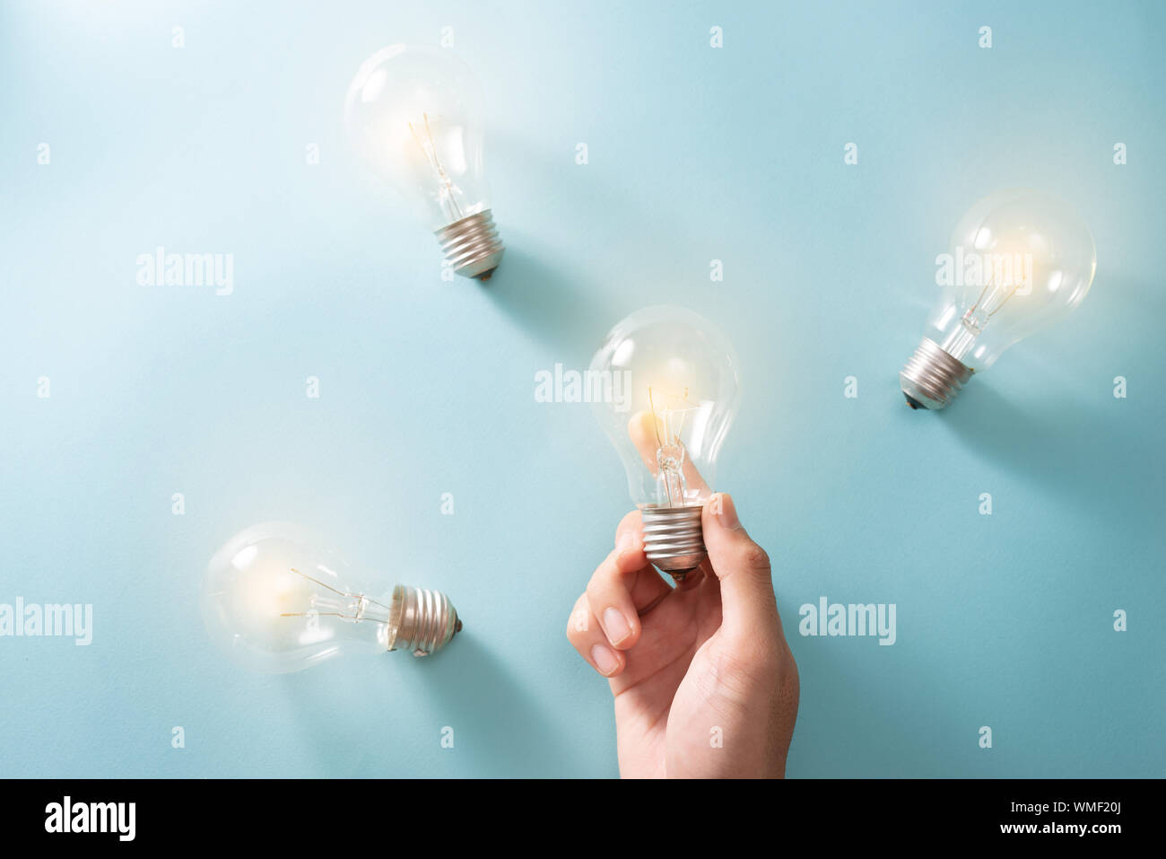 Light bulb with blue background hi-res stock photography and images - Alamy