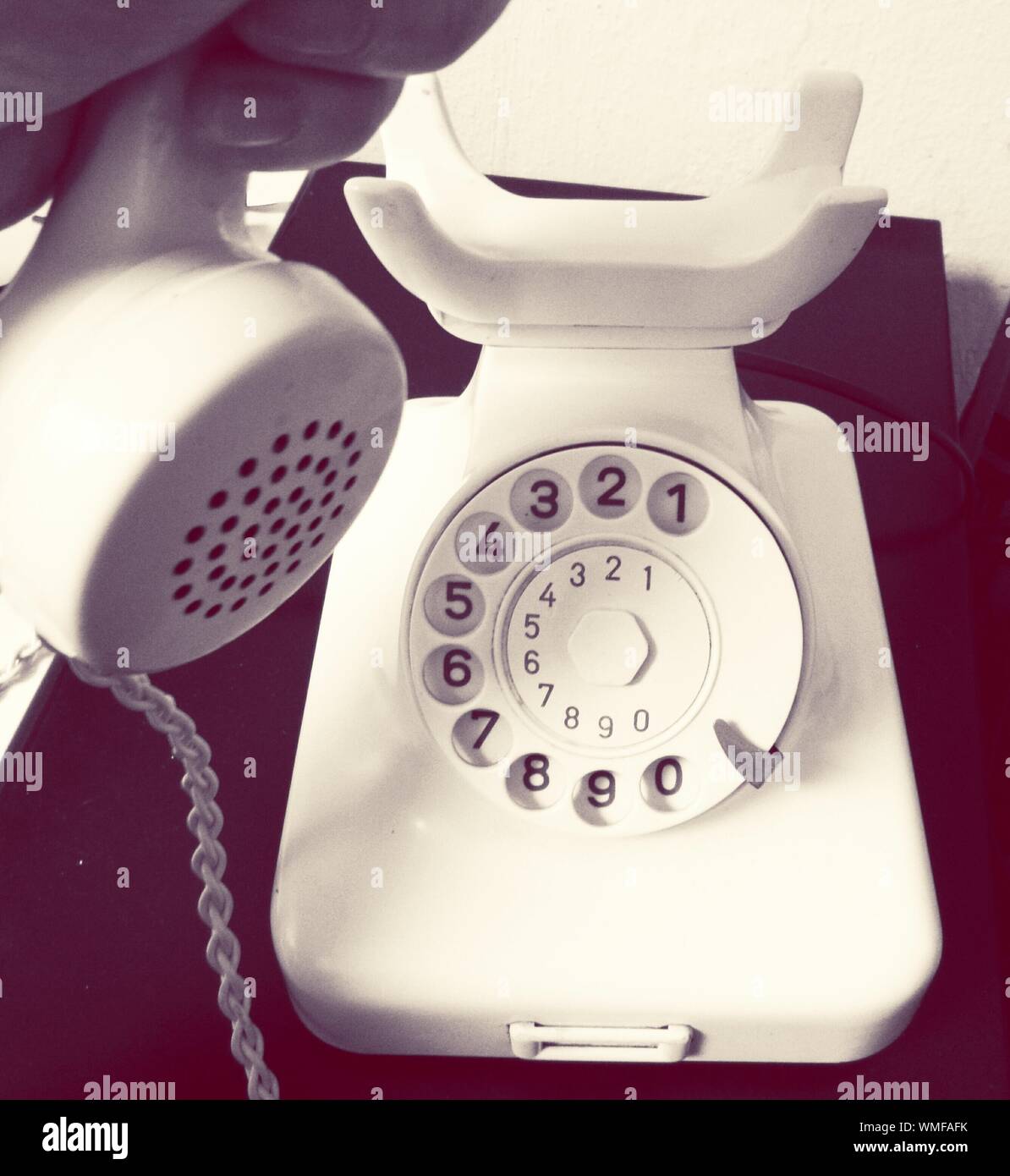 Hand holding landline phone hi-res stock photography and images - Alamy