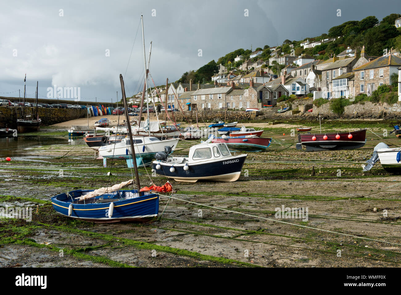 Mousehole fishing village at low tide. Cornwall, England, UK Stock ...