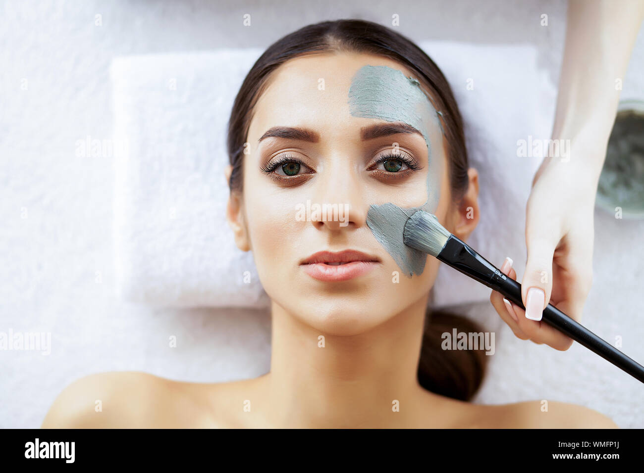 Beauty and Care. Beautiful Young Girl in Spa Salon. Facial Procedures ...