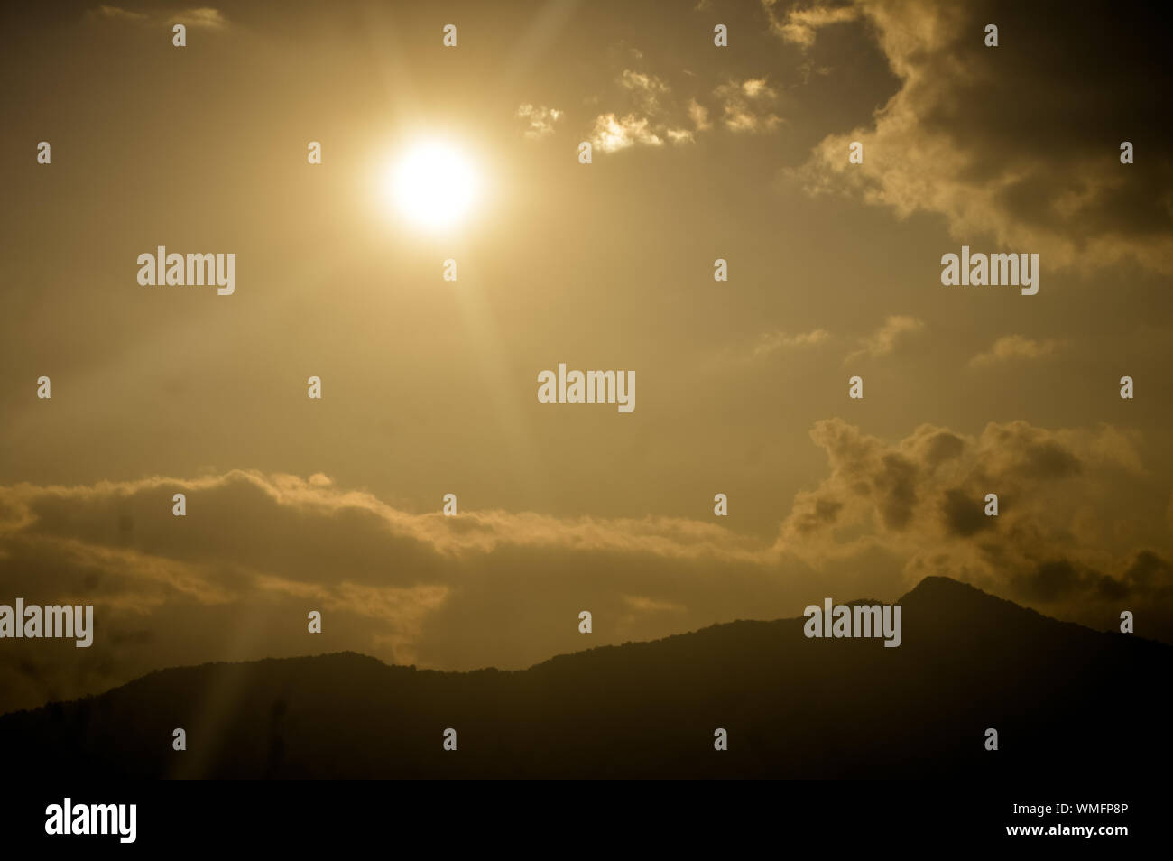 Dramatic dark heavily Red sunset clouds makes the sky romantic on one ...