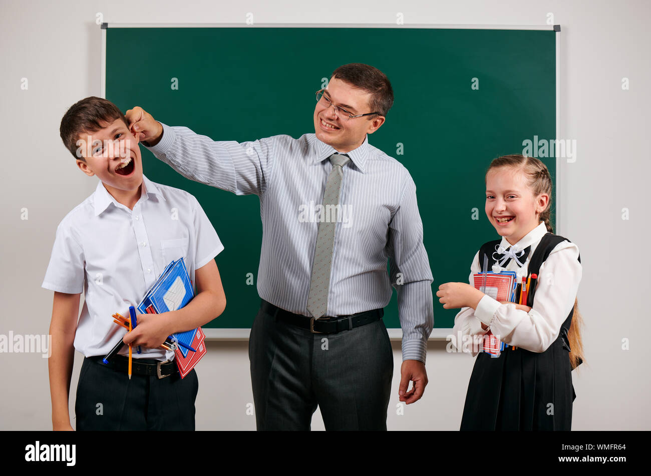 Grab by ear hi-res stock photography and images - Alamy