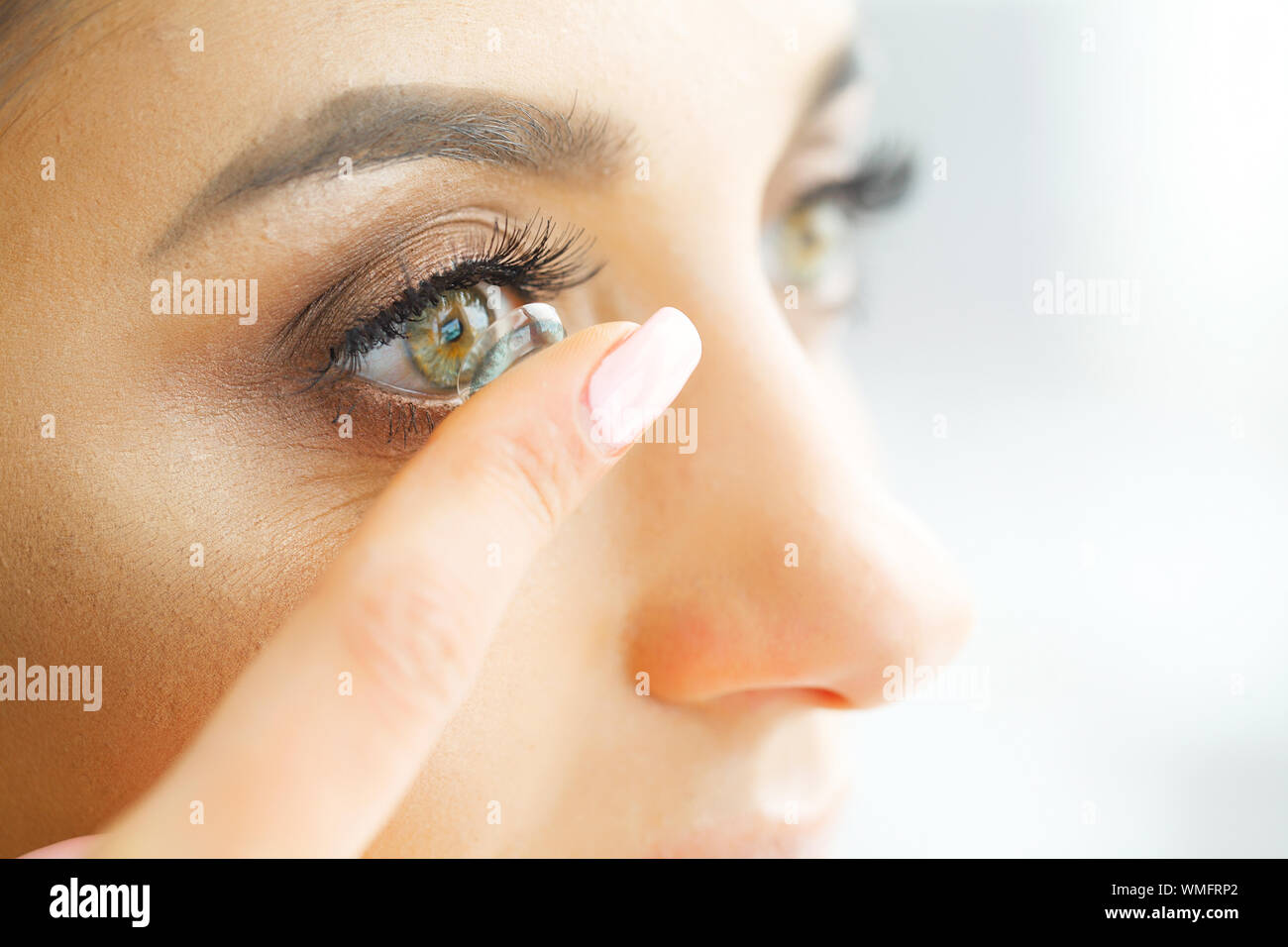 Vision Contact Lenses. Closeup With Beautiful Woman Face Stock Photo ...