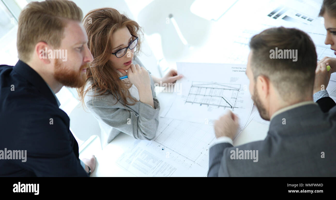 Group of architects working together on project Stock Photo - Alamy