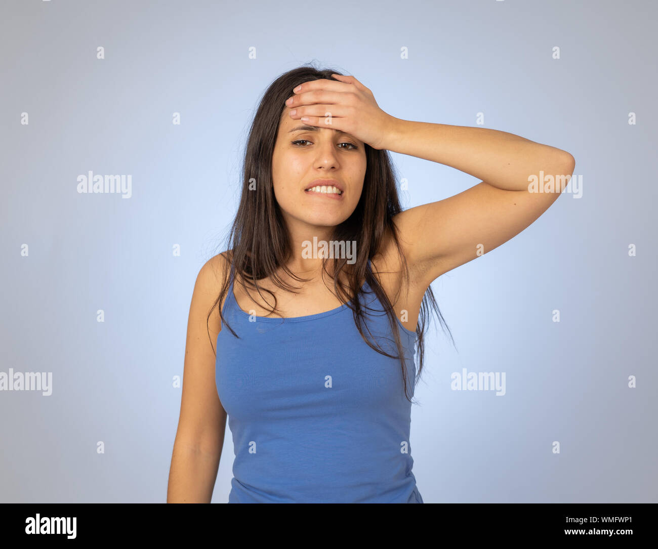 Close up portrait of latin teenager that forgot something or regrets ...