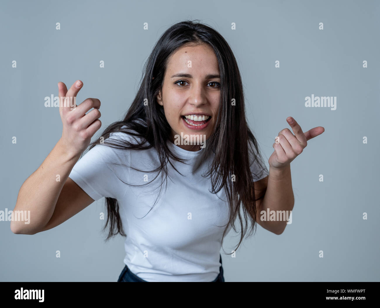Close up of young attractive frustrated latin woman in stress with furious face. Looking mad and ...