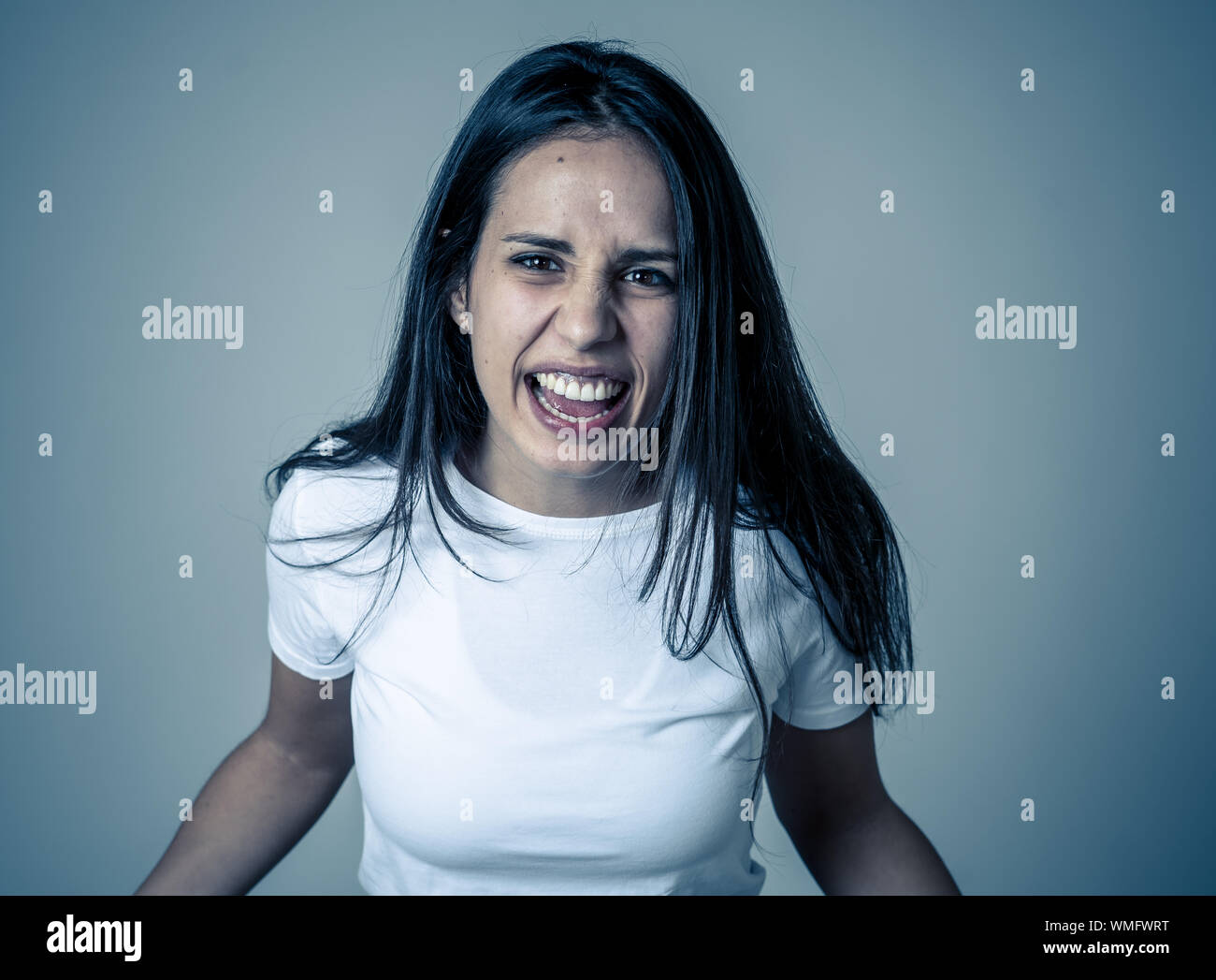 Close up of young attractive frustrated latin woman in stress with ...