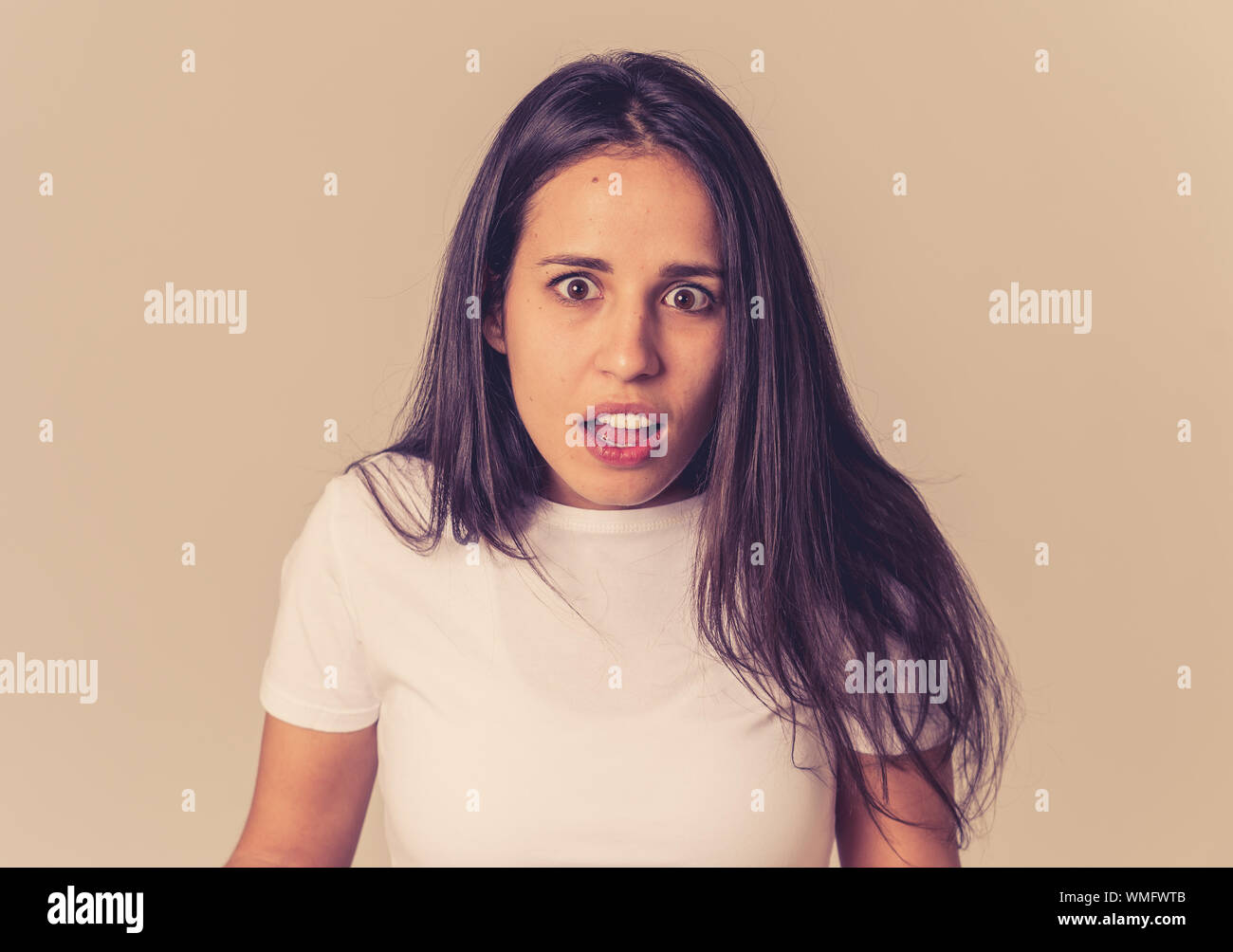 Portrait of beautiful shocked woman hearing good news or having great ...