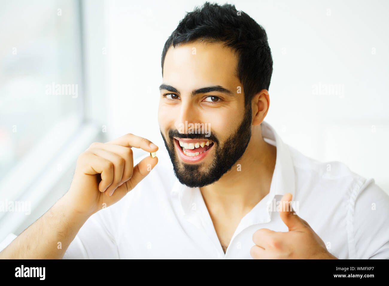 Beautiful Man Taking Pill, Medicine. Vitamins And Supplements Stock ...
