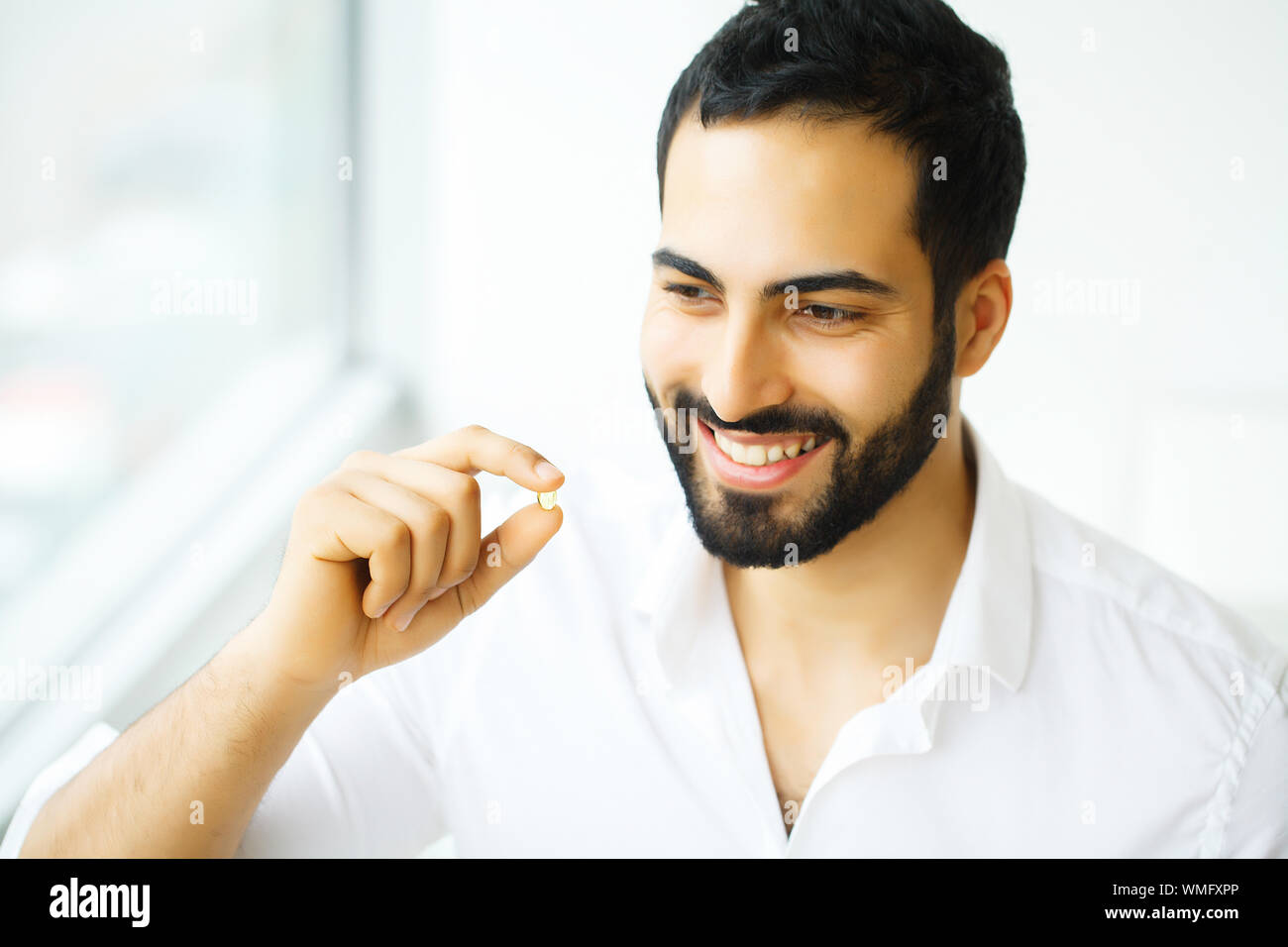Beautiful Man Taking Pill, Medicine. Vitamins And Supplements Stock ...