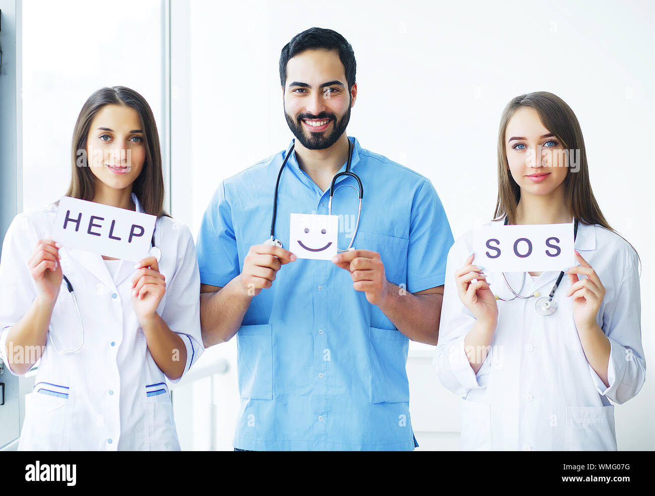 Health Care. Medical Team Holding Inscriptions For Help at the Hospital ...
