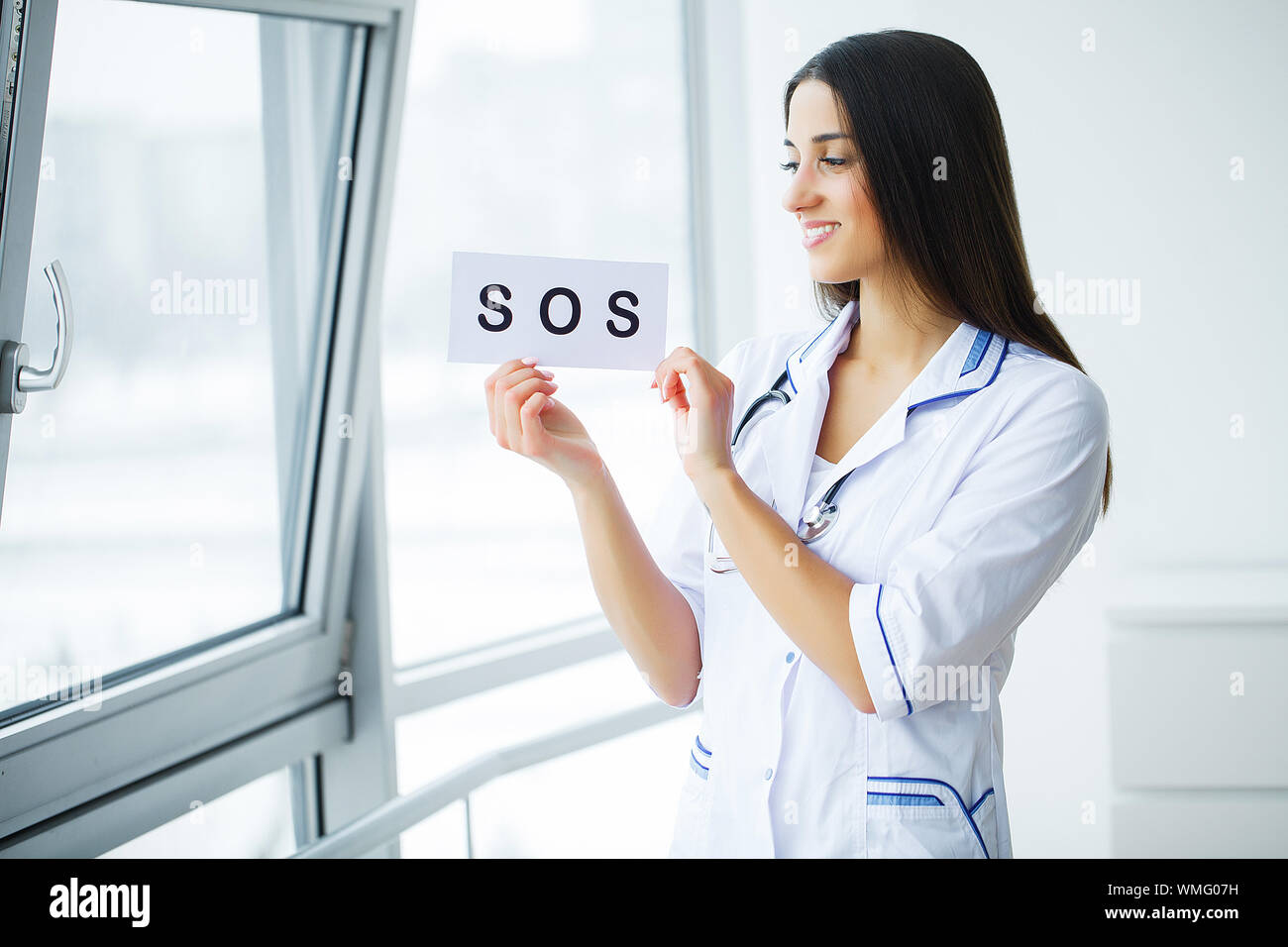 Health Care. Doctor Holding a Card With Symbol HELP, Medical Concept ...