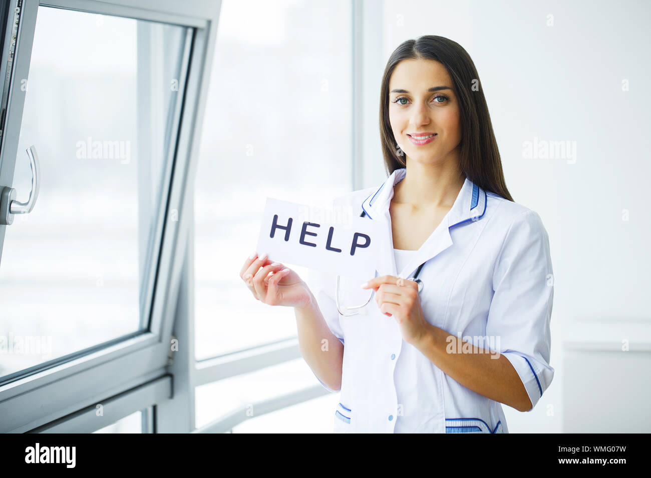 Health Care. Doctor Holding a Card With Symbol HELP, Medical Concept ...