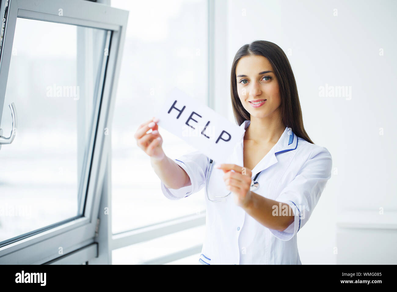 Health Care. Doctor Holding a Card With Symbol HELP, Medical Concept ...