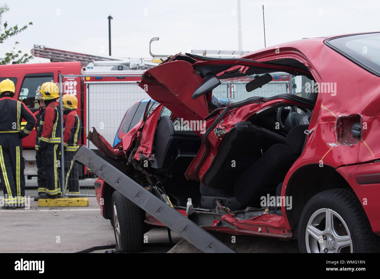 firefighters at road traffic accident scene Stock Photo - Alamy