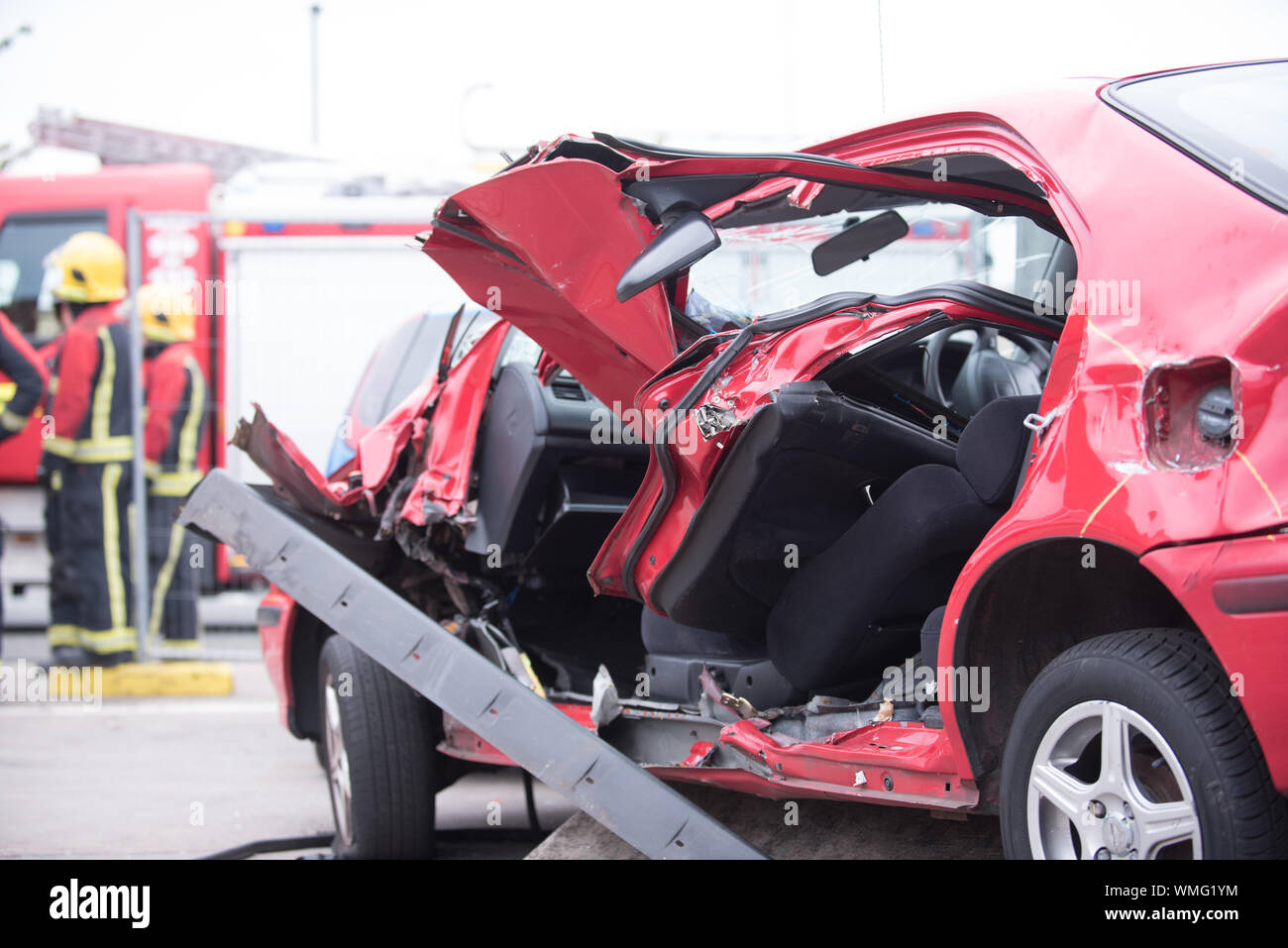 firefighters at road traffic accident scene Stock Photo - Alamy