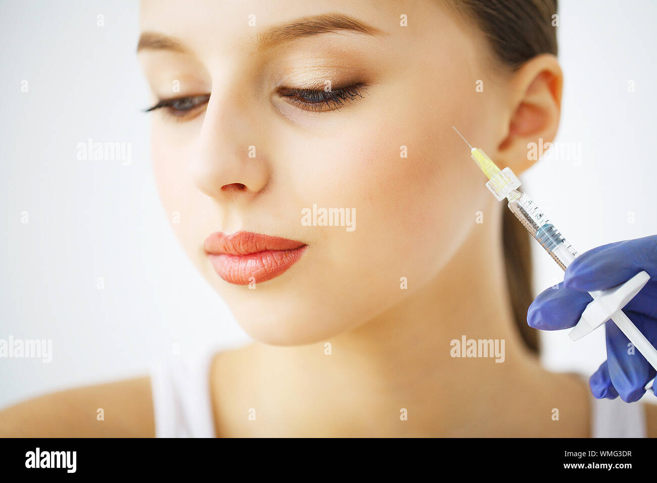 Close up of hands of cosmetologist making botox injection in female ...