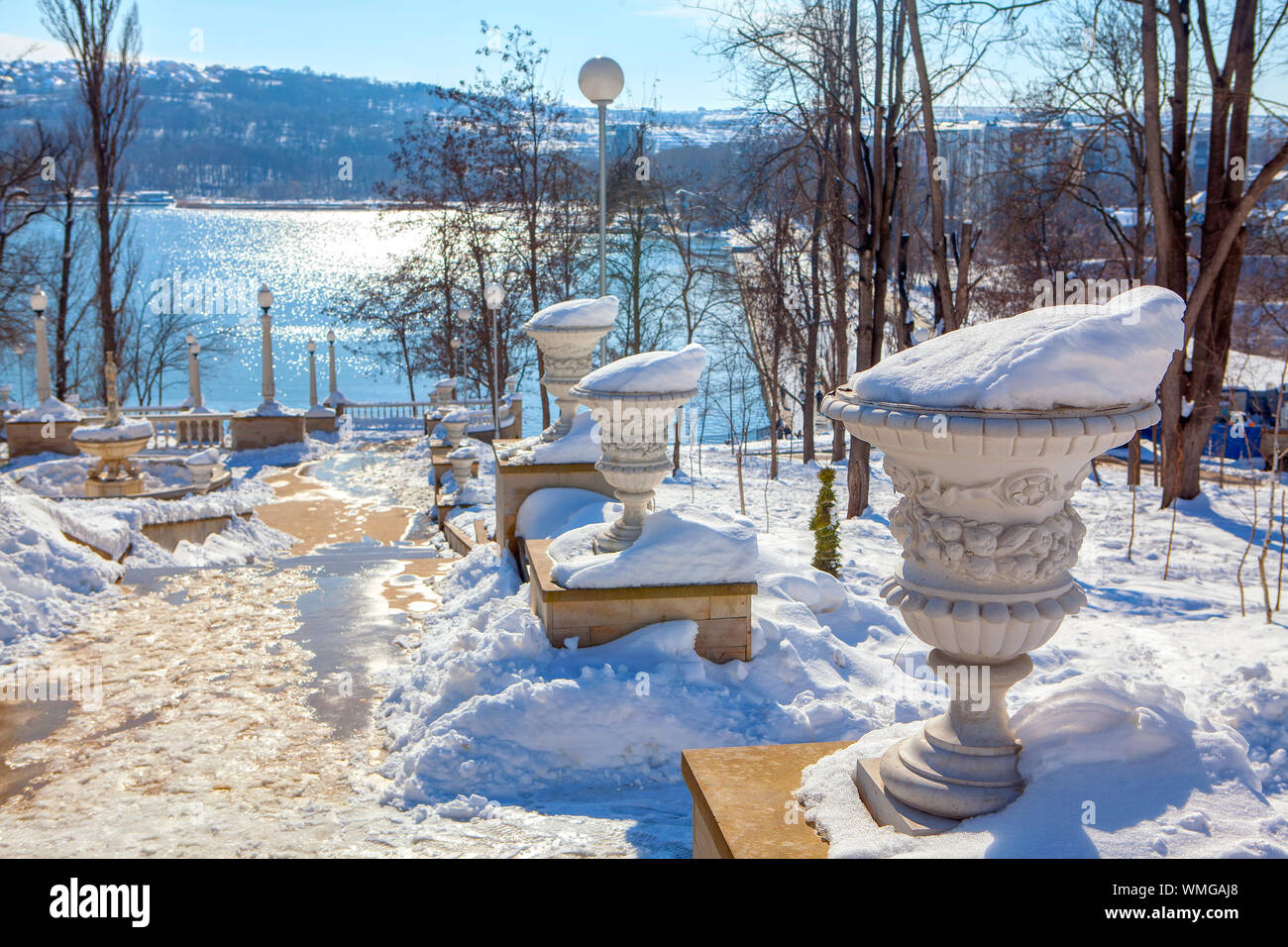 flower pots in the park covered by snow Stock Photo - Alamy